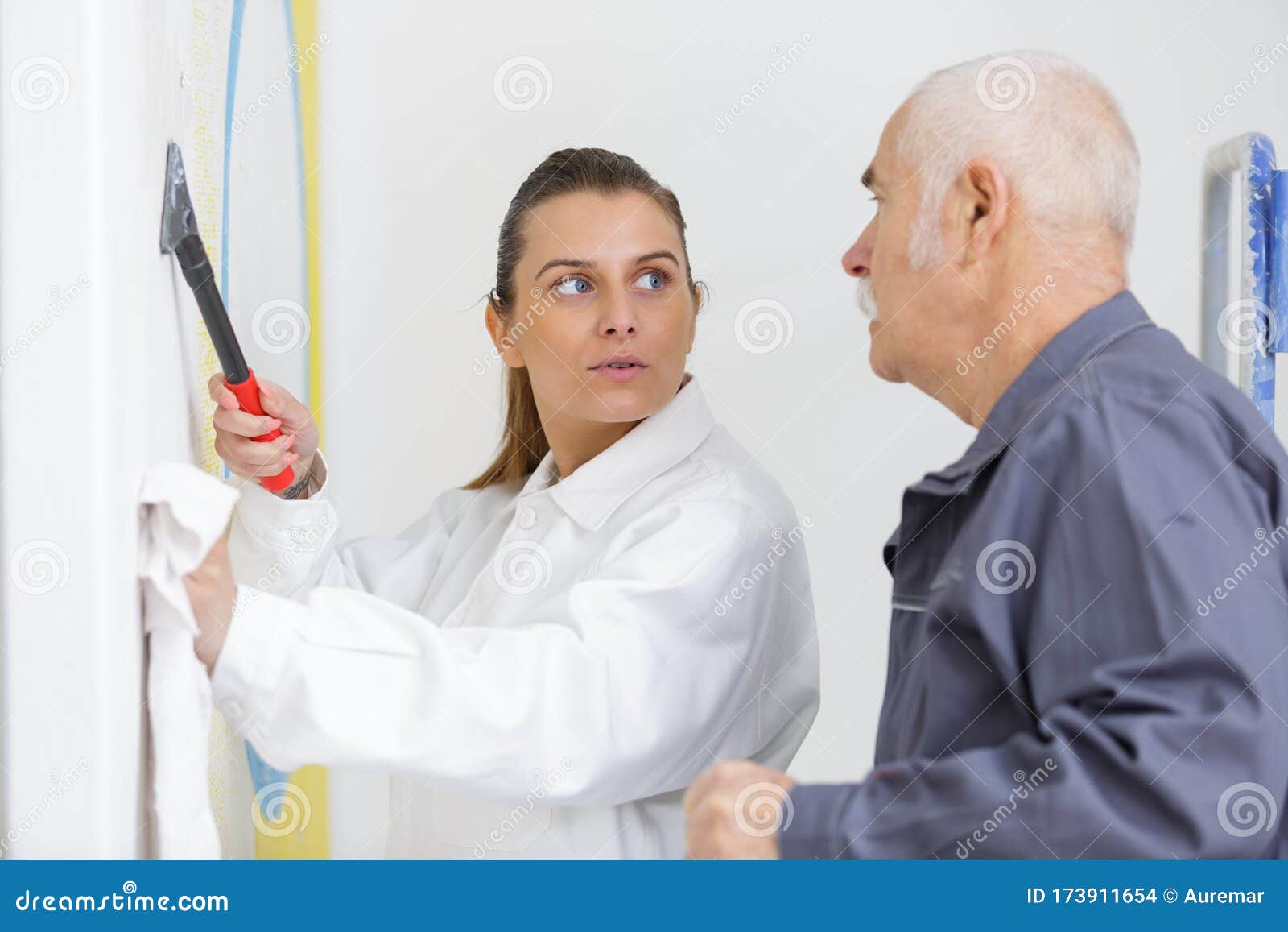 Apprentice Decorator Learning To Use Scraper To Prepare Wall Stock ...