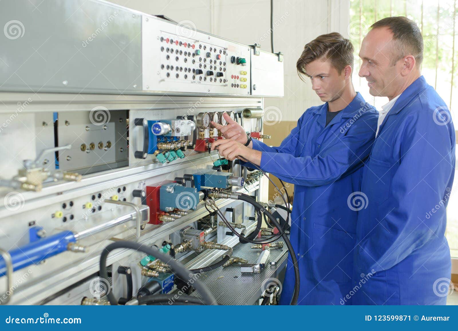 Apprentice Electrician and Tutor Stock Image - Image of complicated ...