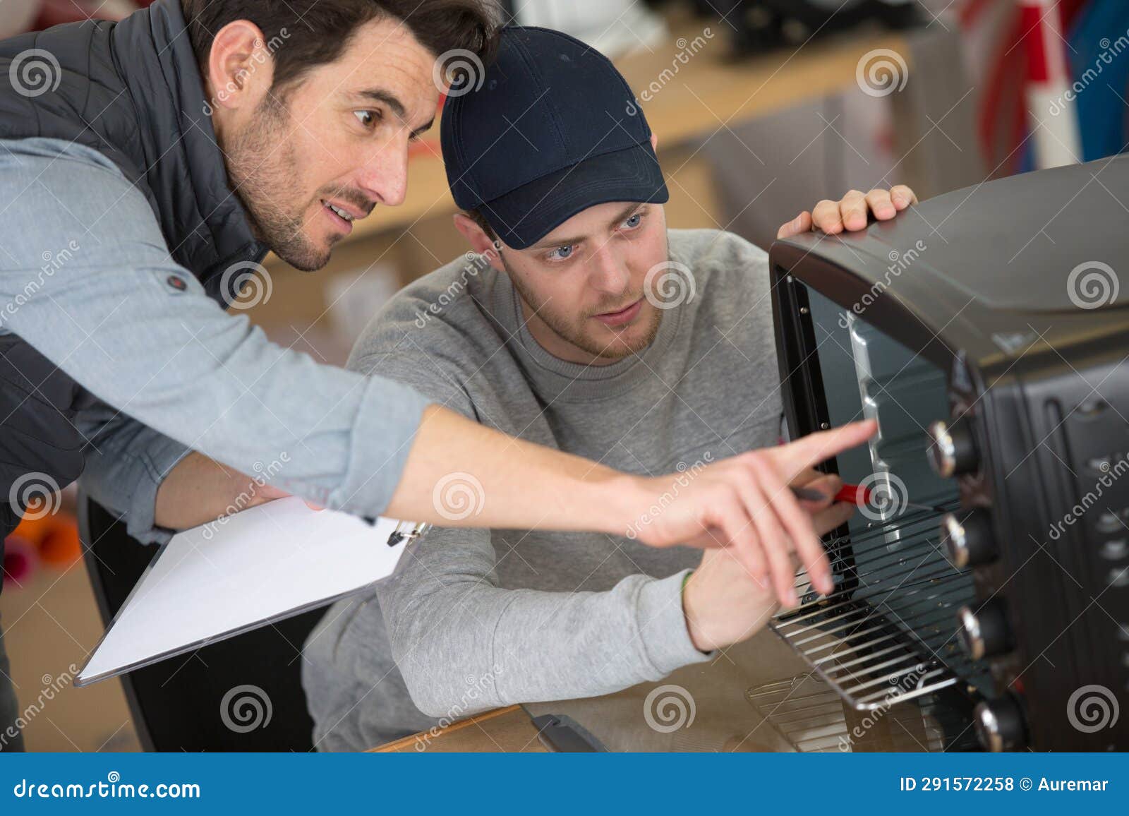 Apprentice Engineer Learning How To Repair Oven Stock Photo - Image of ...