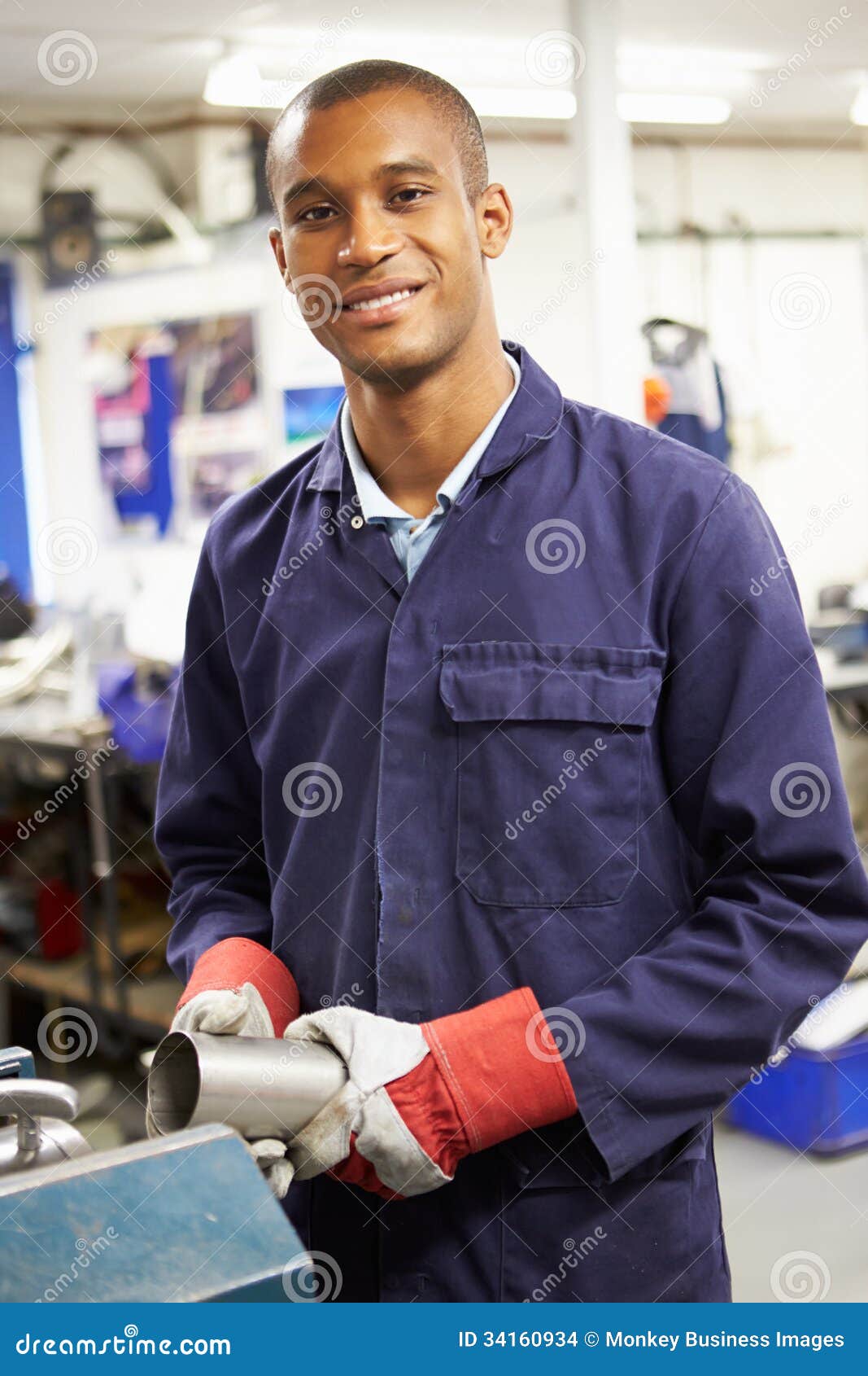 Apprentice Engineer Working on Factory Floor Stock Photo - Image of ...