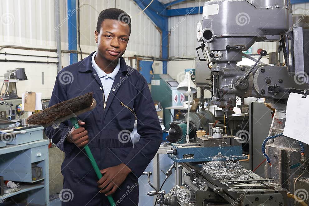 Apprentice in Engineering Factory Sweeping Floor Stock Photo - Image of ...