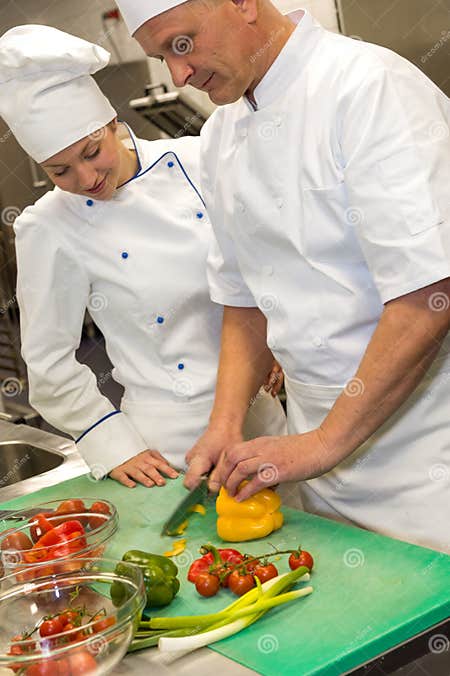 Apprentice Learning Cutting Vegetables from Chef Stock Image - Image of ...