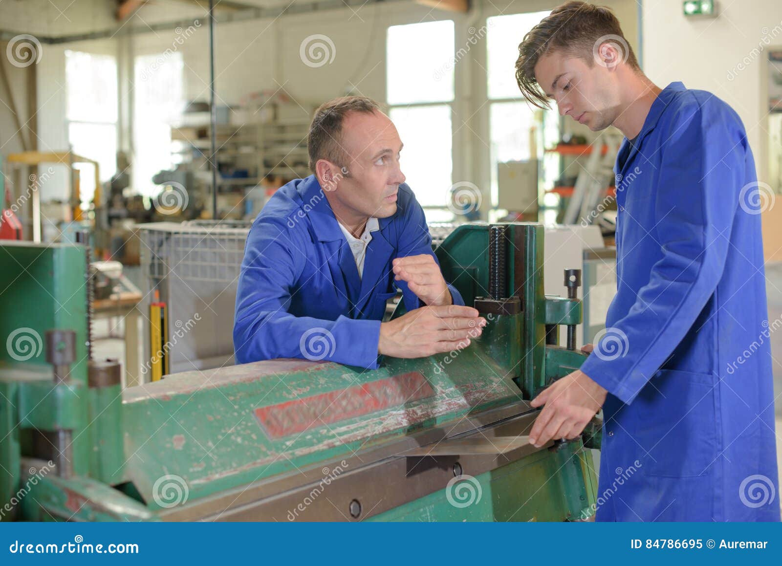 Apprentice Learning To Use Machine Stock Image - Image of industry ...
