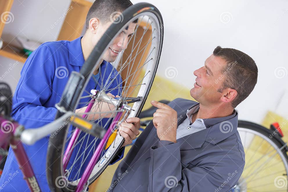 Apprentice Looking at Bikes Wheel Stock Image - Image of alternative ...