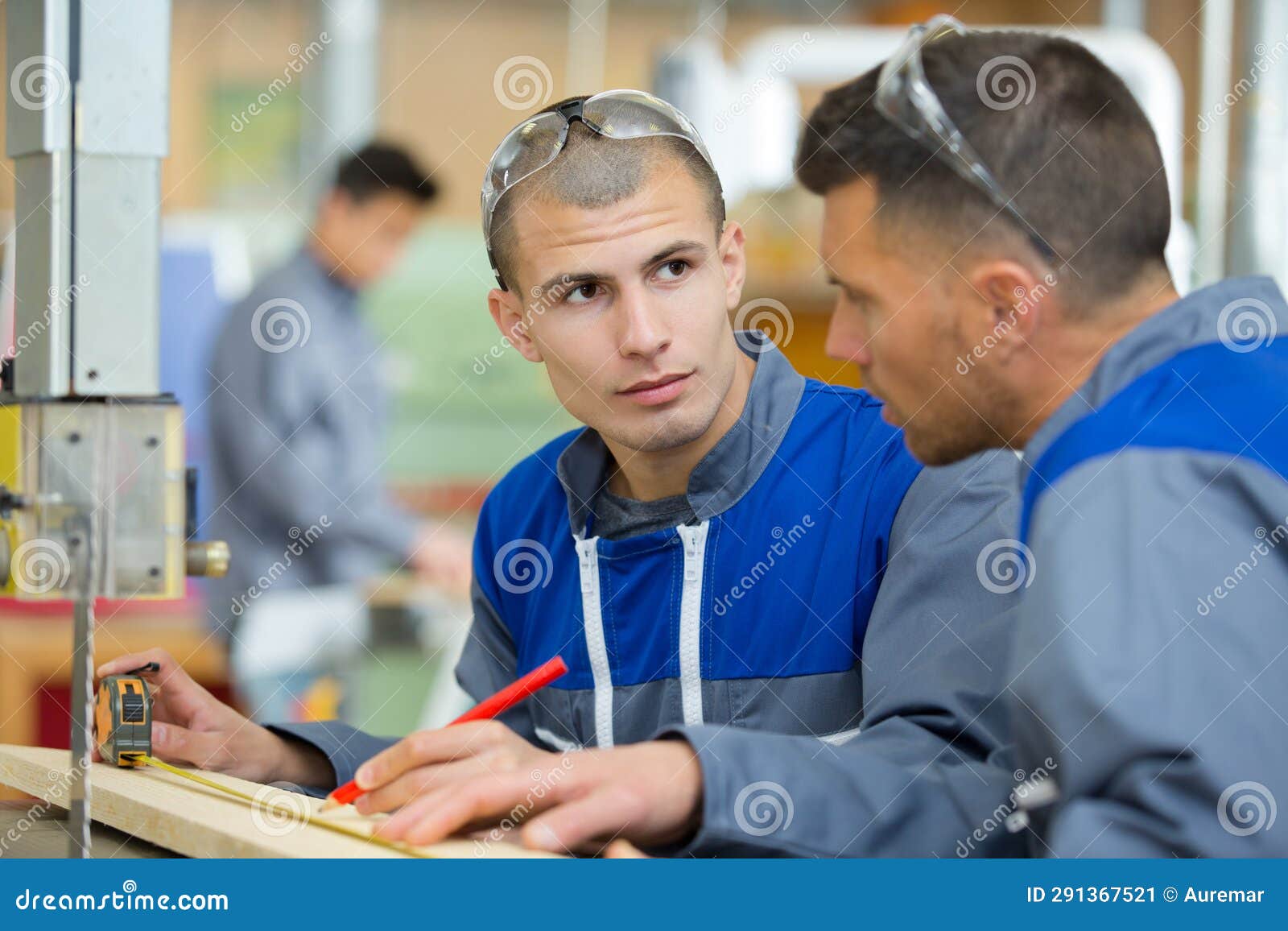 Apprentice Makes Measurements on Board Stock Image - Image of square ...