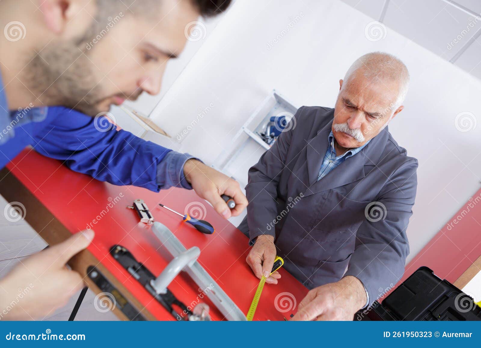 Apprentice and Master Measuring Door Stock Image - Image of craftsman ...