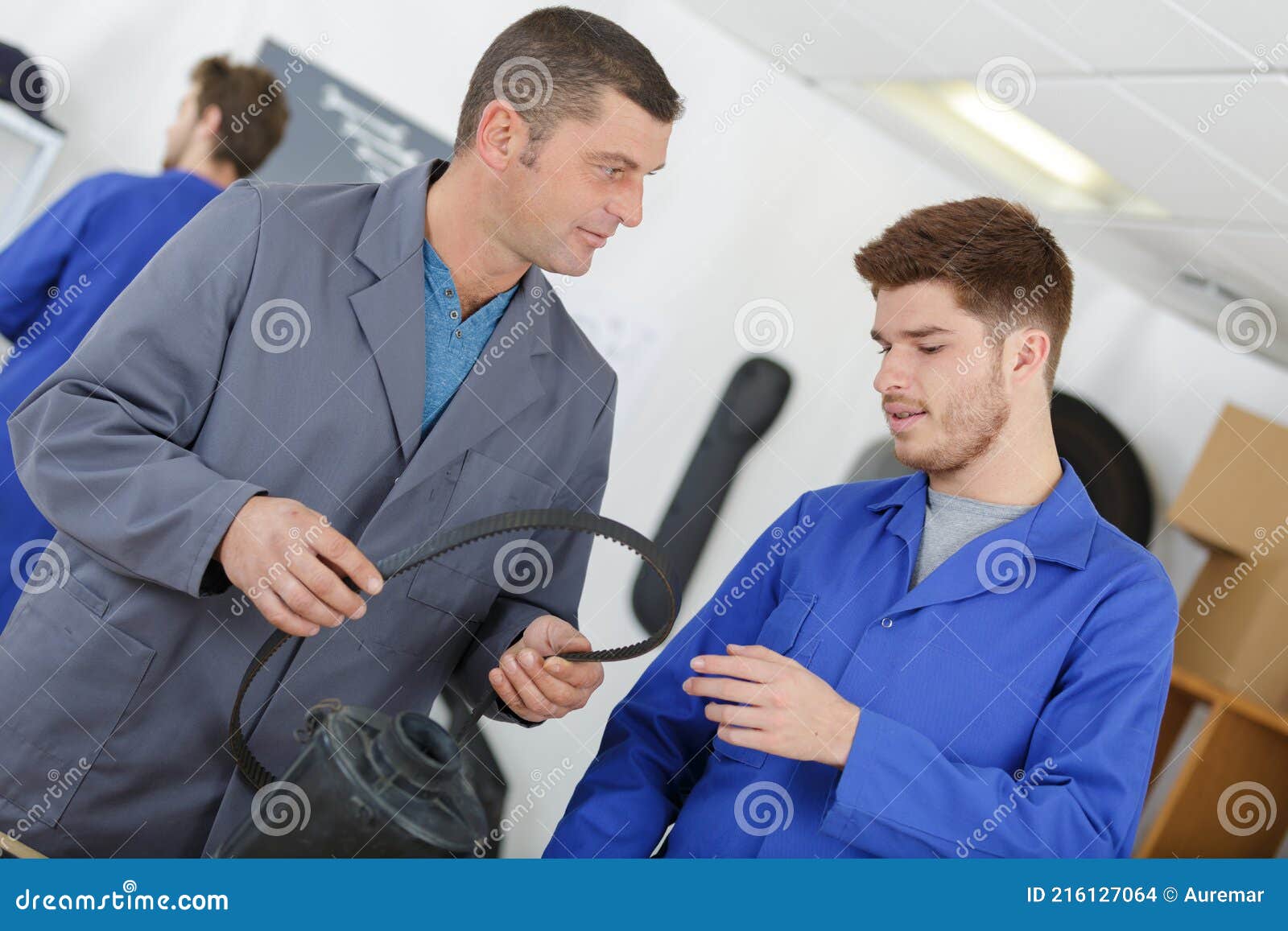 Apprentice Mechanic in Auto Shop Working on Car Part Stock Photo ...