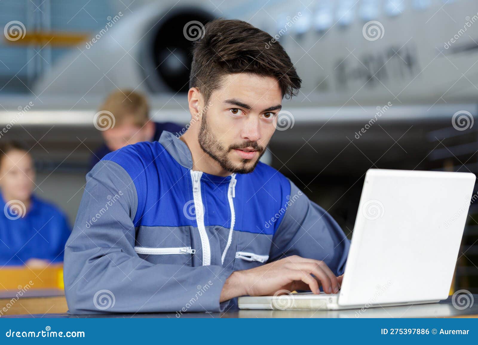 Apprentice Mechanic Diagnosing Car Problem with Computer Stock Photo ...