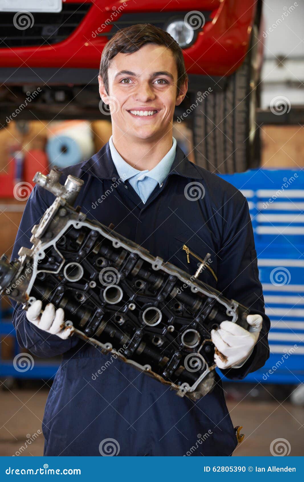 Apprentice Mechanic Holding Engine Block Stock Photo - Image of ...