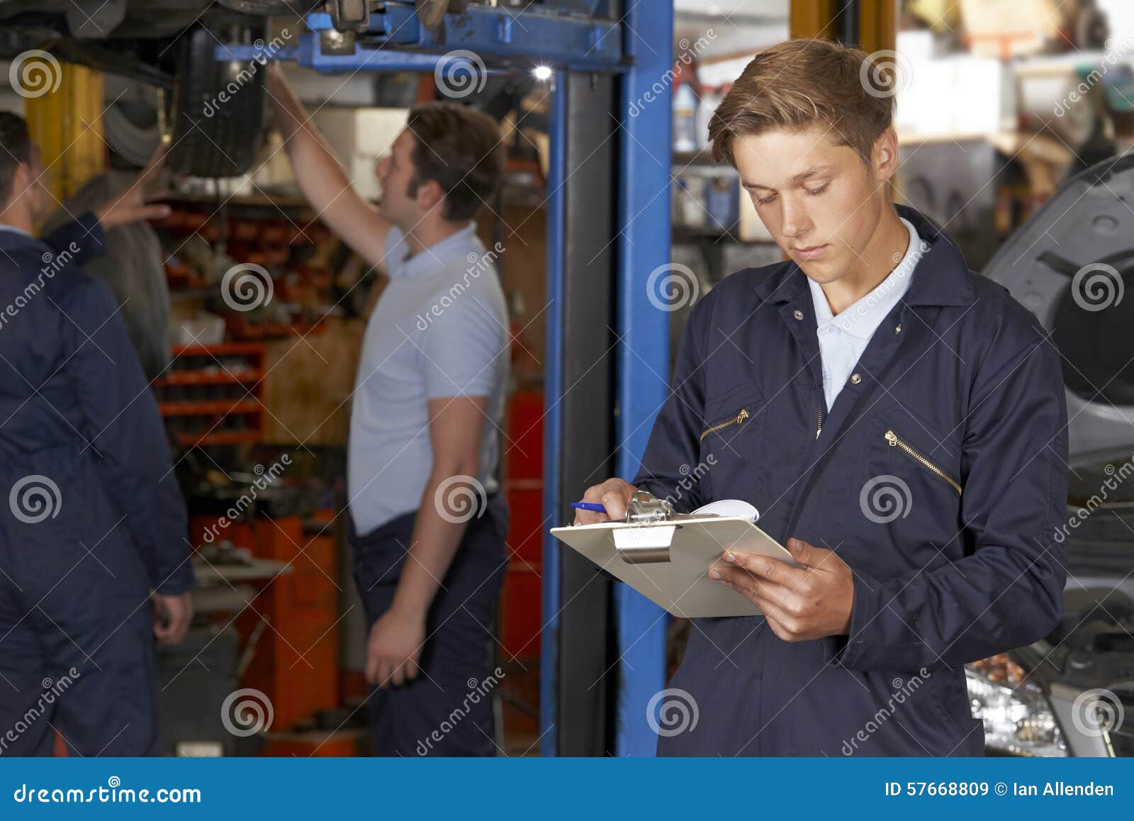 Apprentice Mechanic Working in Auto Repair Shop Stock Image - Image of ...