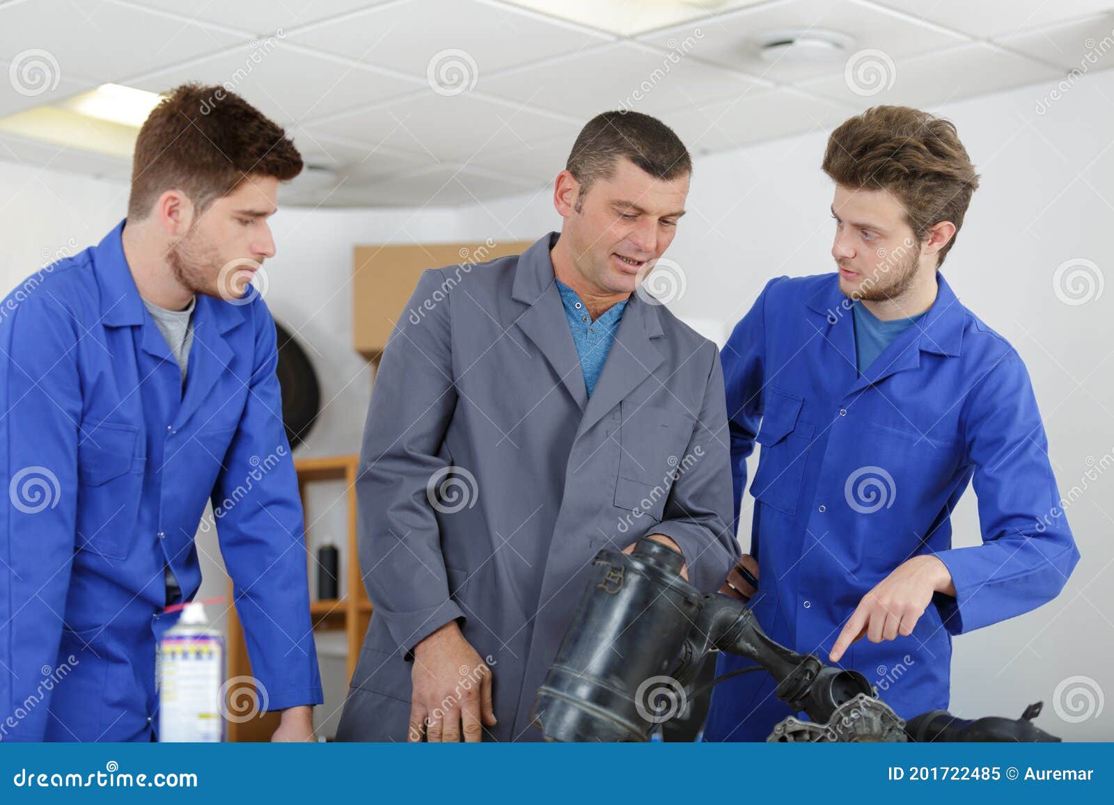 Apprentice Mechanics in Auto Shop Working on Car Engine Stock Image ...
