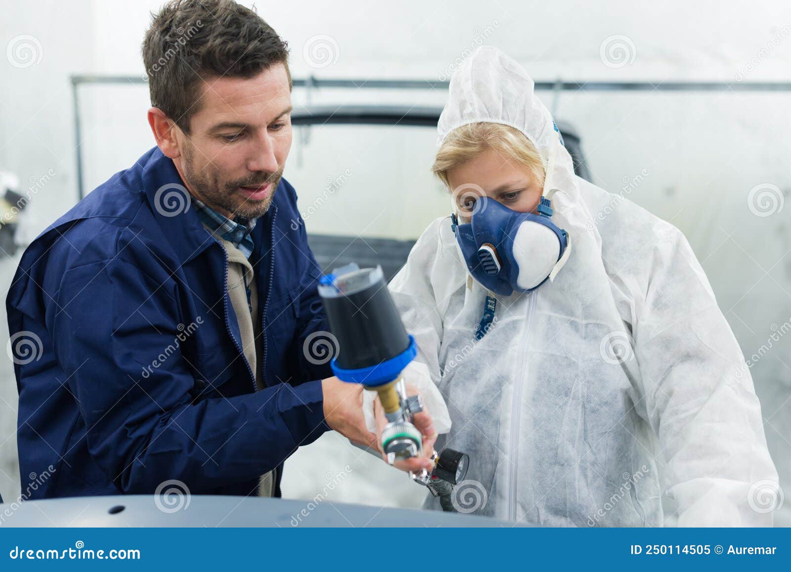 Apprentice Painter with Airgun Spraying Paint Stock Image - Image of repair, spray: 250114505