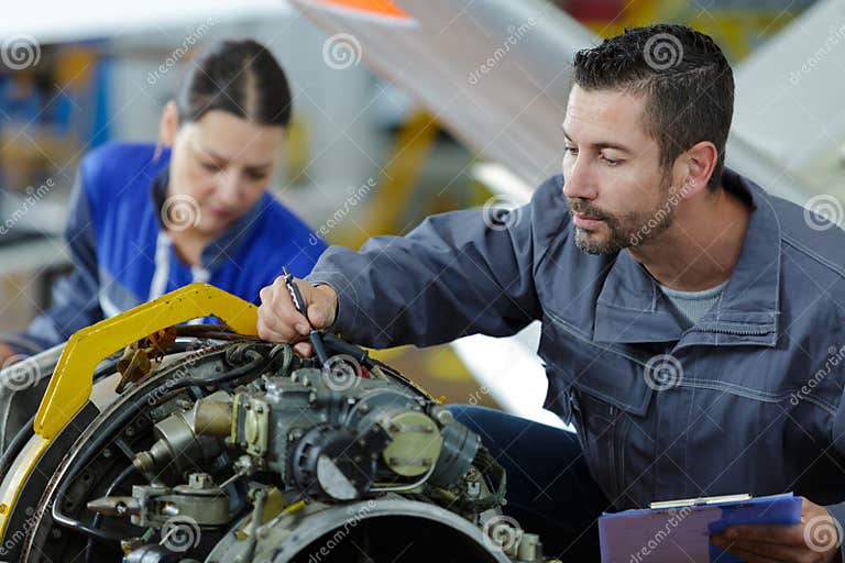 Apprentice Studying Car Engines with Mechanic Stock Image - Image of ...