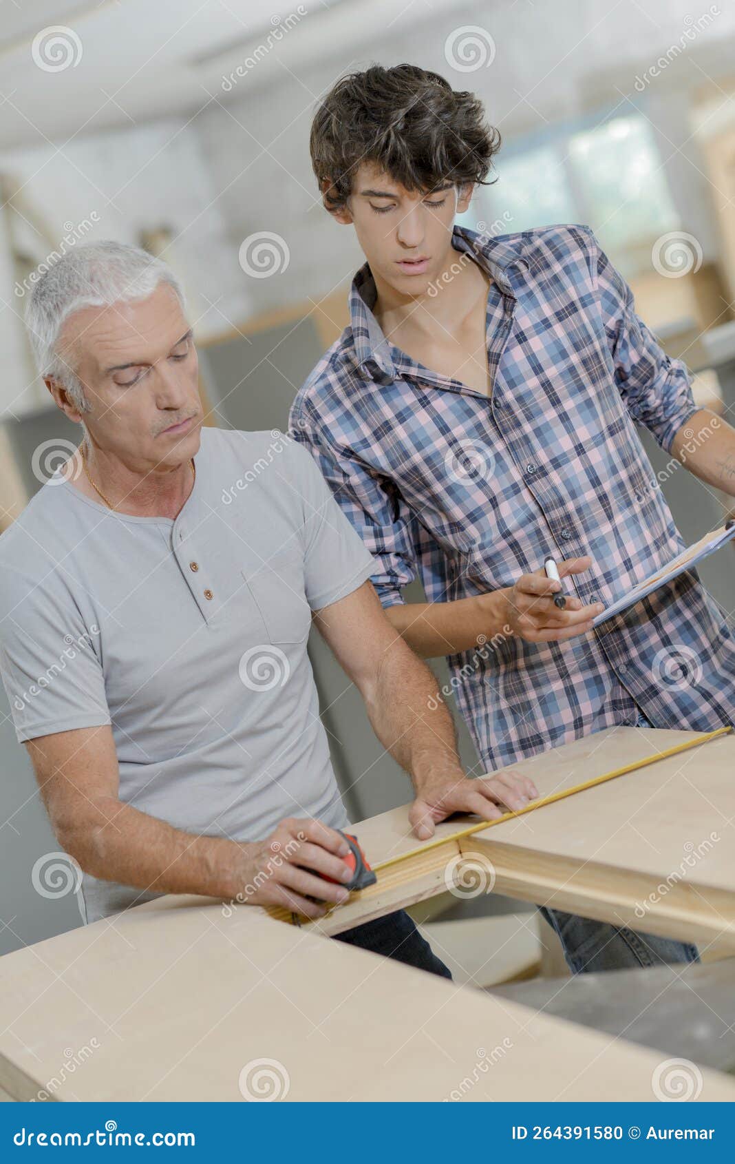 Apprentice taking notes stock photo. Image of manual - 264391580