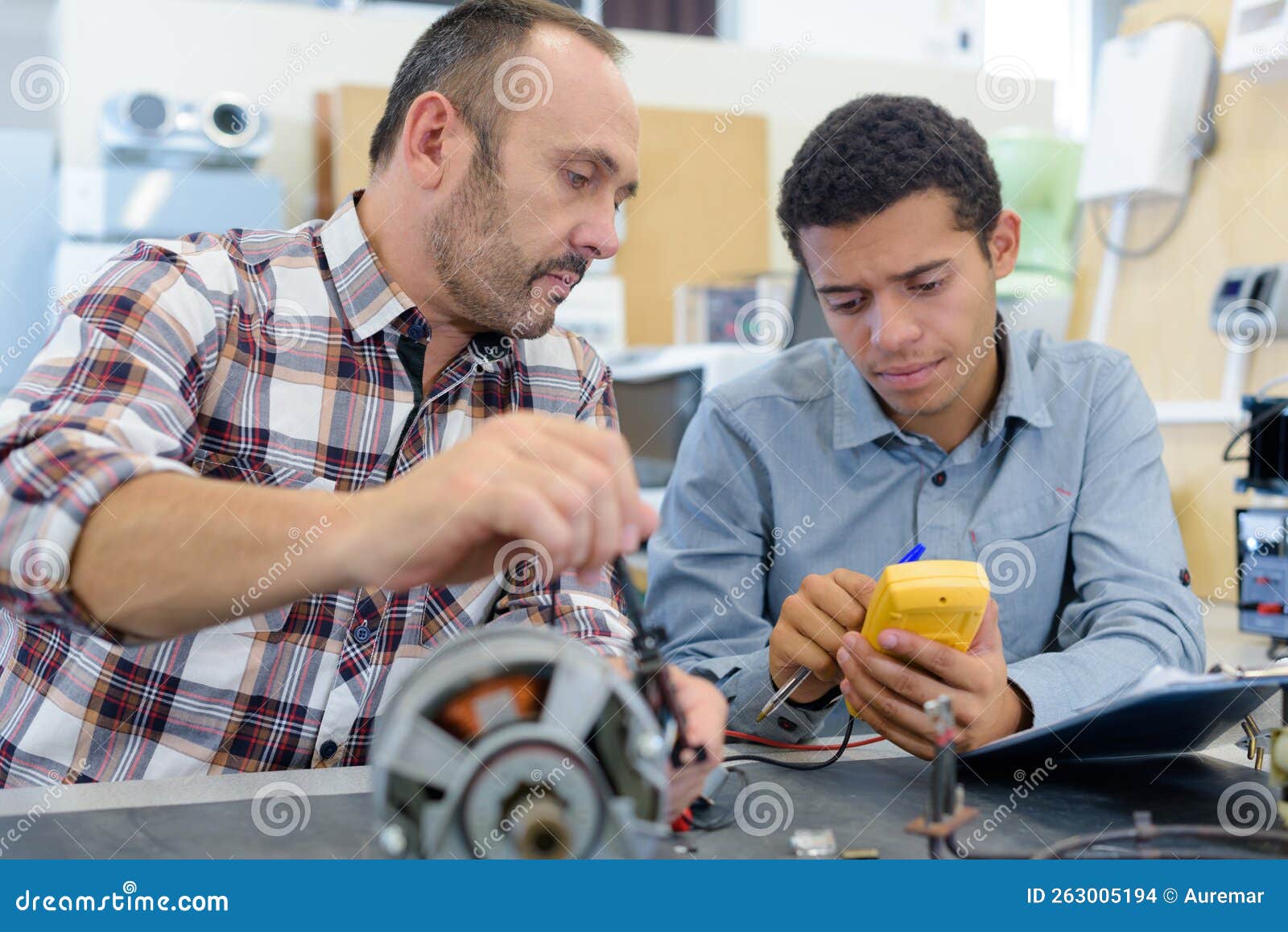 Apprentice and Teacher Electrician Measuring Voltage Stock Photo ...