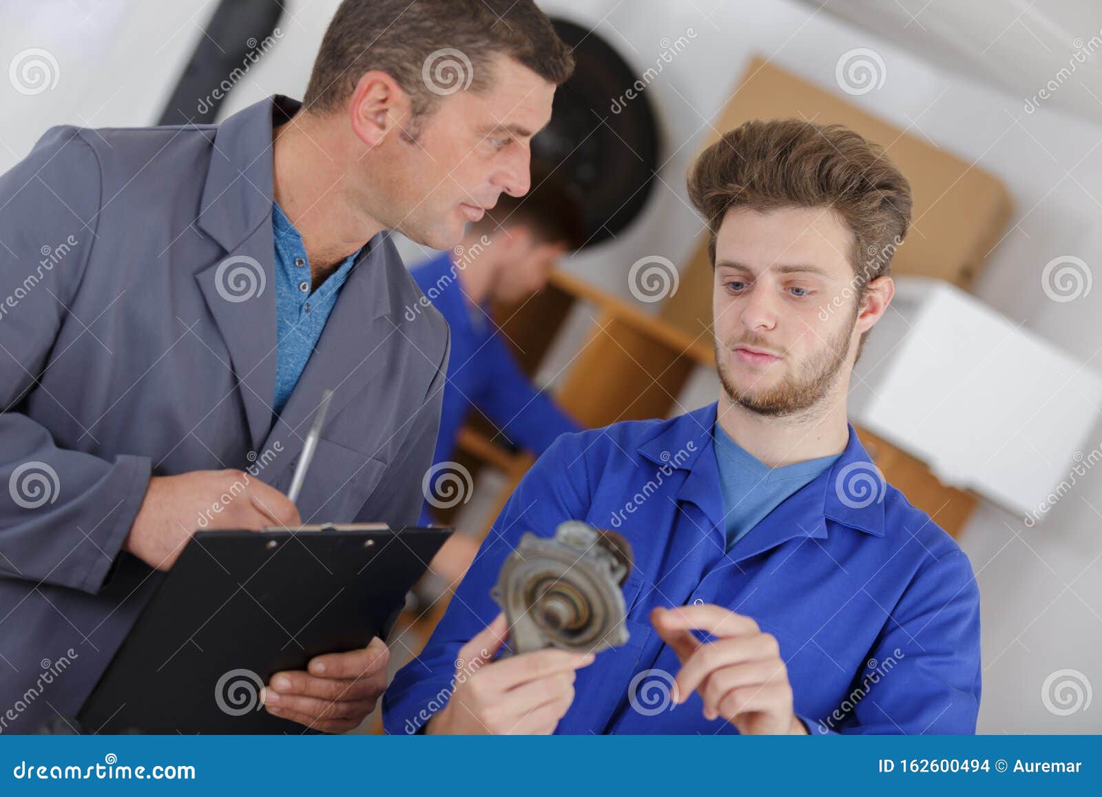 Apprentice and Teacher in Garage Stock Photo - Image of steel, cylinder ...