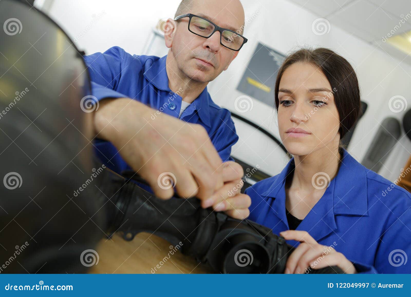 Apprentice and the teacher stock image. Image of procedure - 122049997