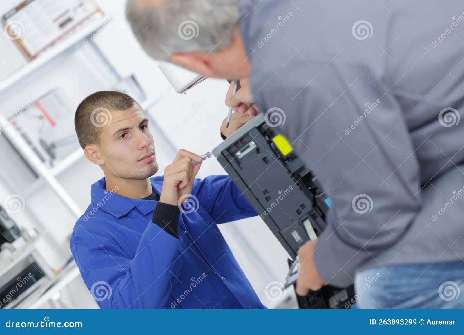 Apprentice Technician Working on Appliance Stock Image - Image of ...