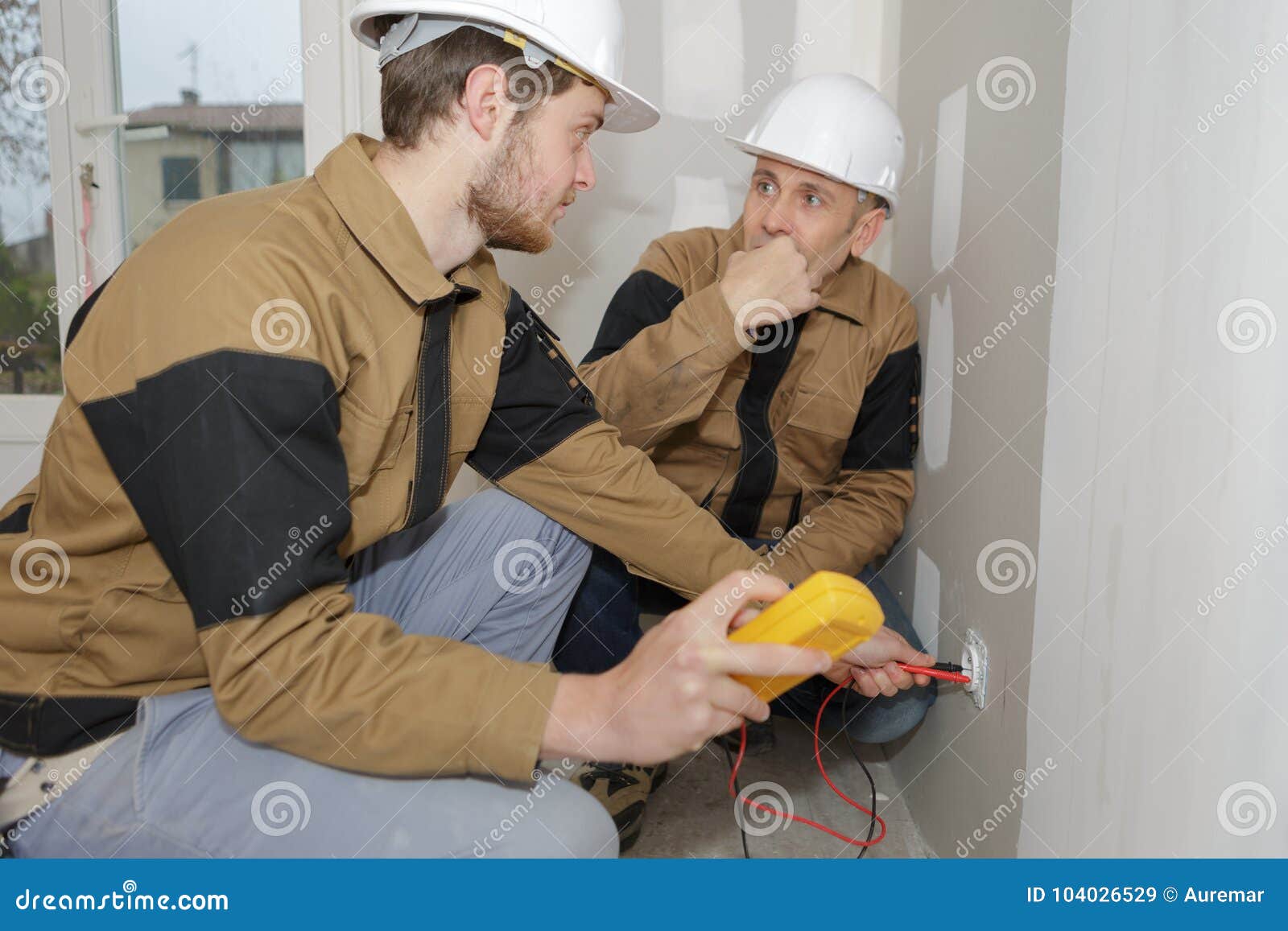 Apprentice Testing Plugs for Electricity Stock Image - Image of ...