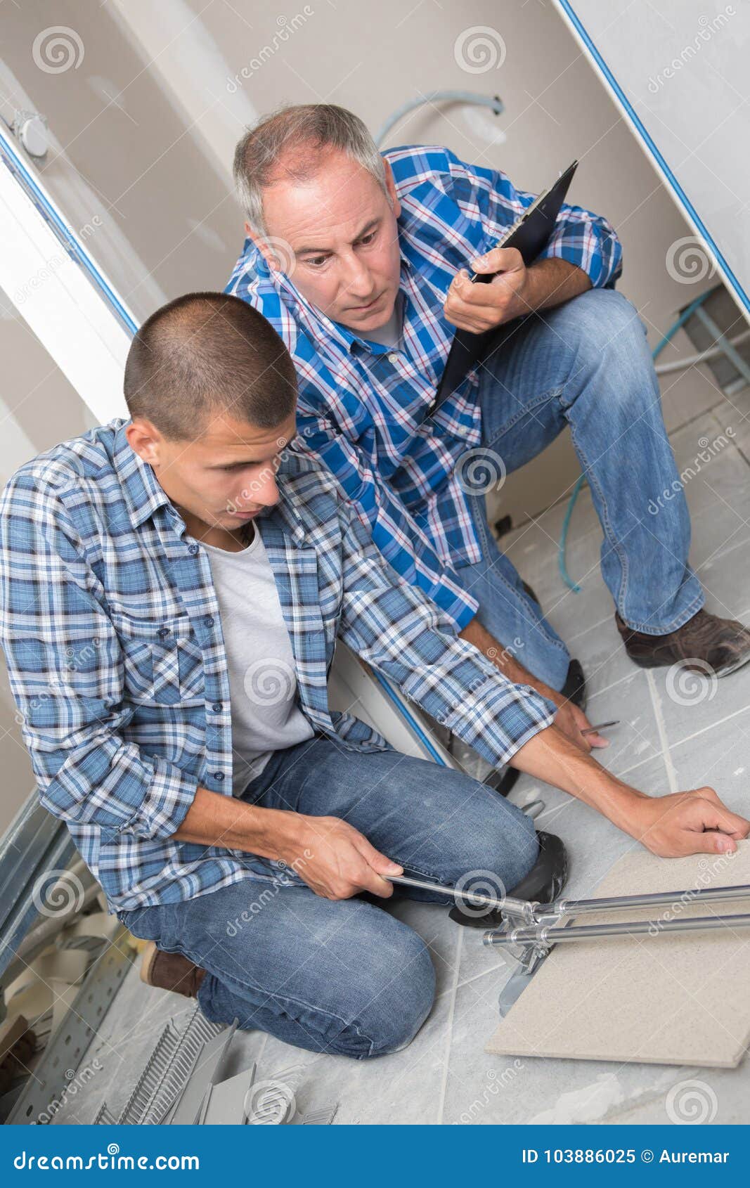 Apprentice Tile Setter Cutting Tile Stock Image - Image of duty ...