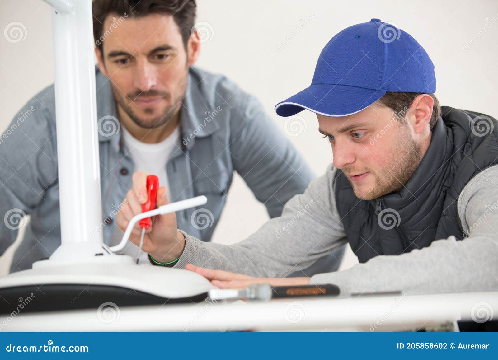 Apprentice Working Under Professor Supervision Stock Photo - Image of ...