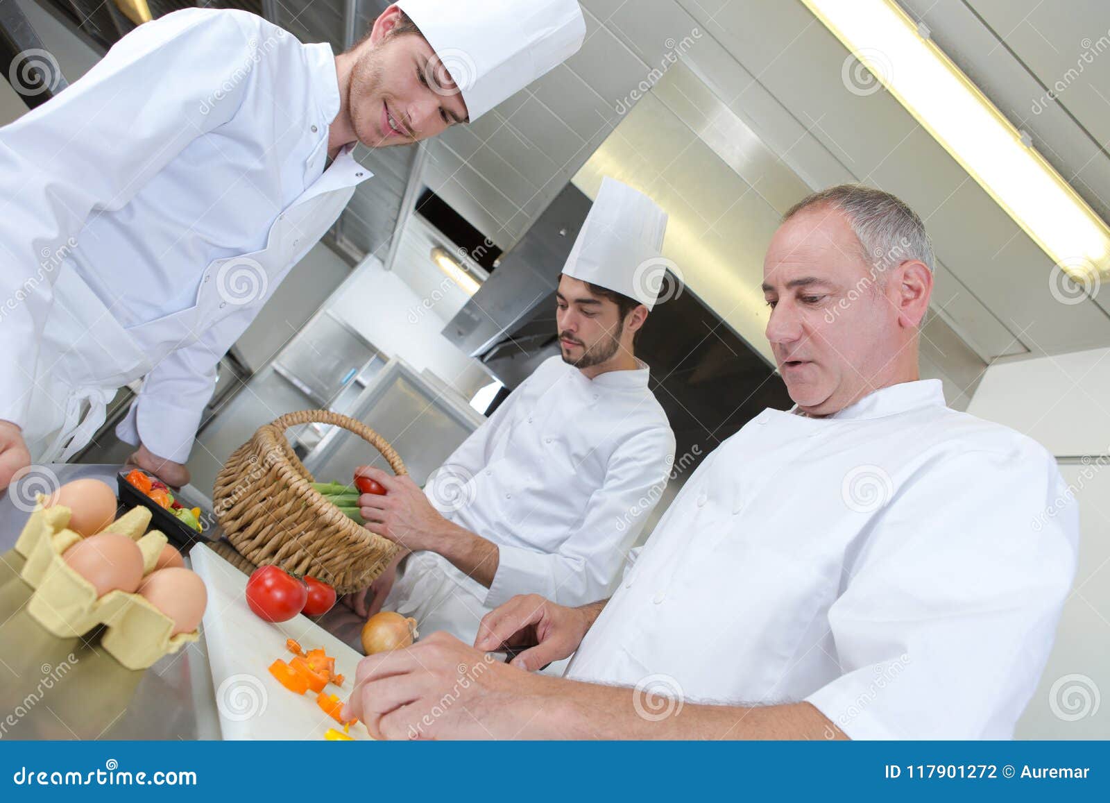 2 Apprentices Cooks Learning from Master Chef Stock Photo - Image of ...