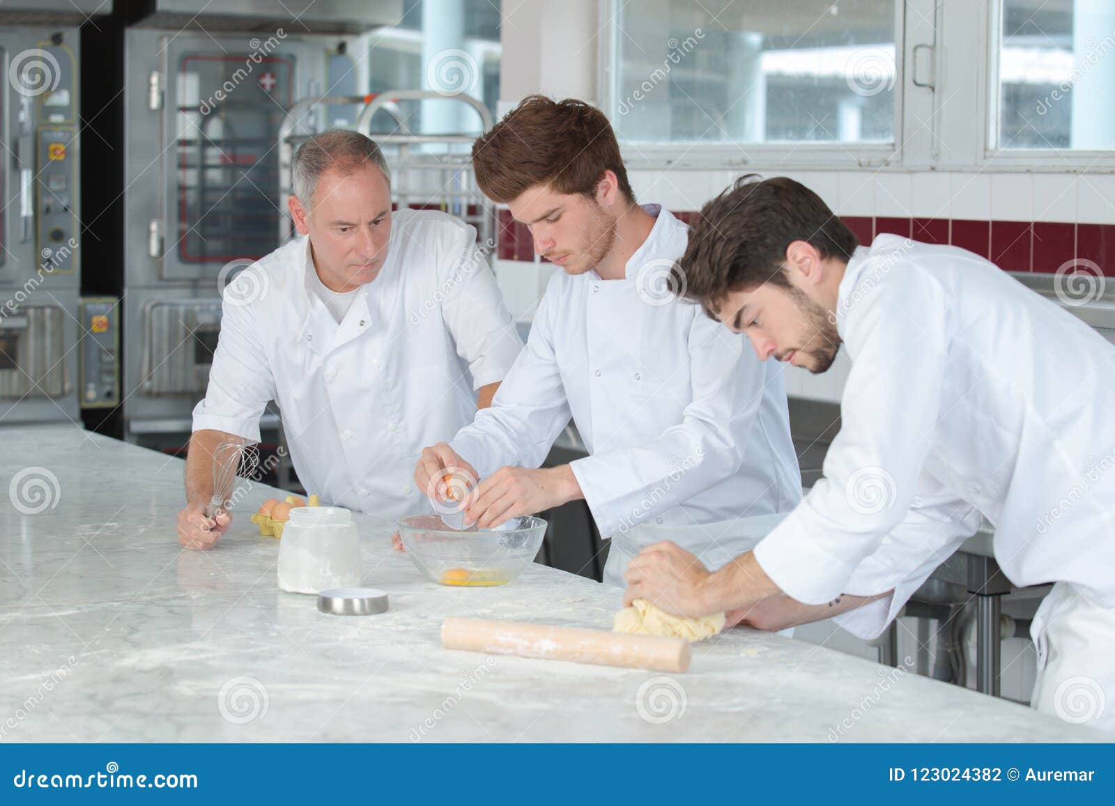 Apprentices Learning with Baker Master Stock Photo - Image of teacher ...