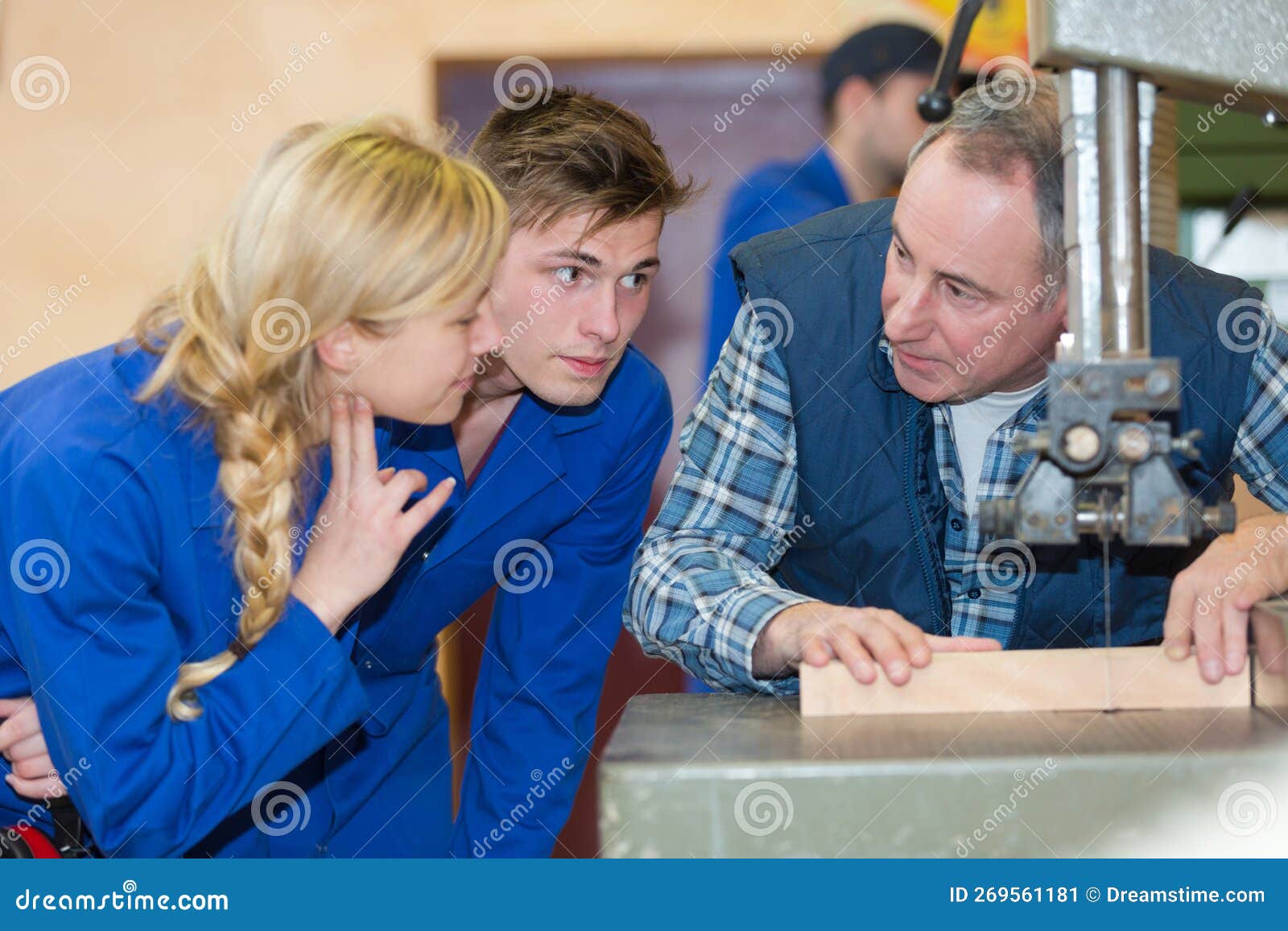Apprentices Learning To Use Electronic Wood Cutting Machine Stock Image ...