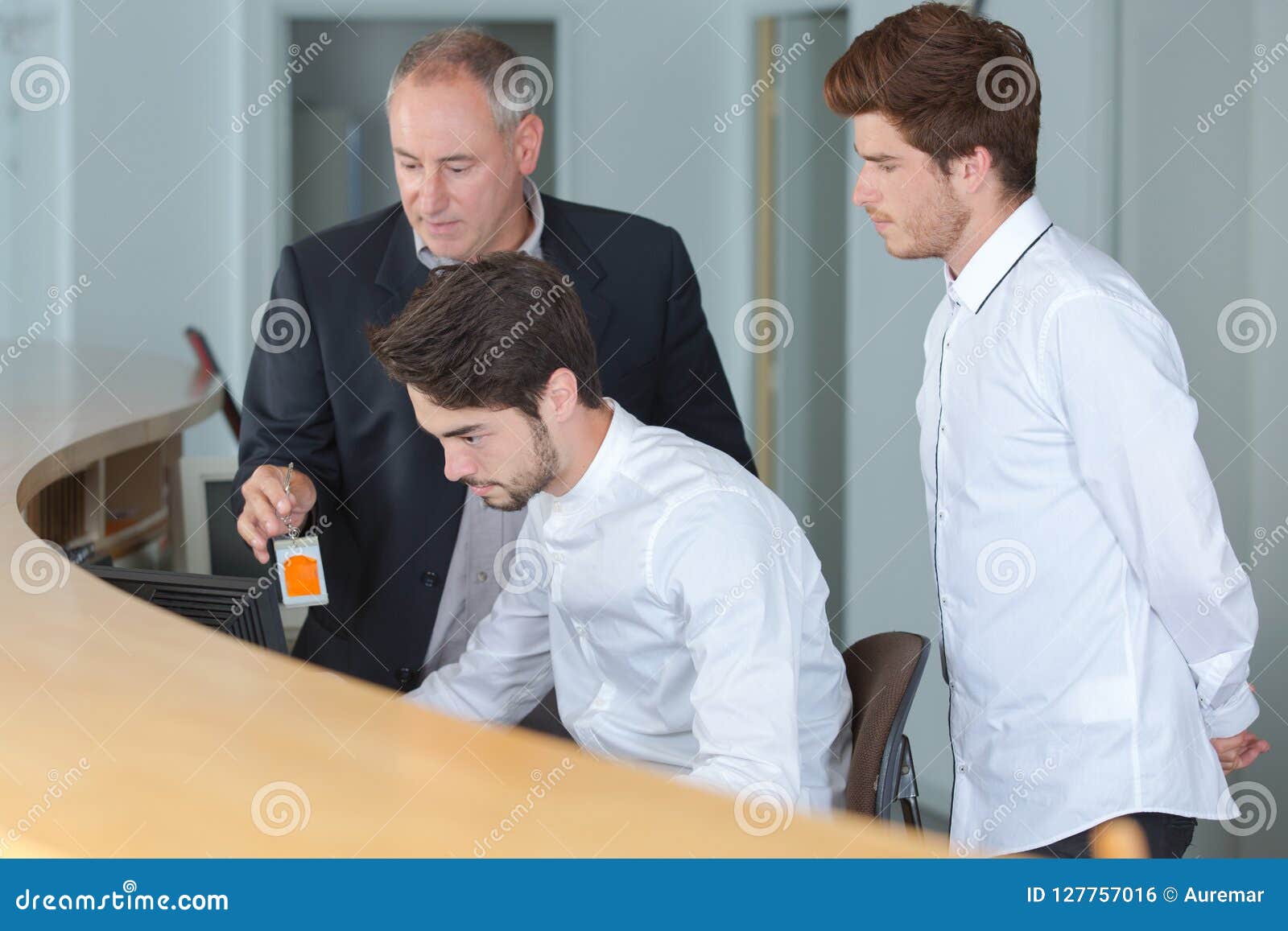 Apprentices Standing at Hotel Reception Stock Photo - Image of ...