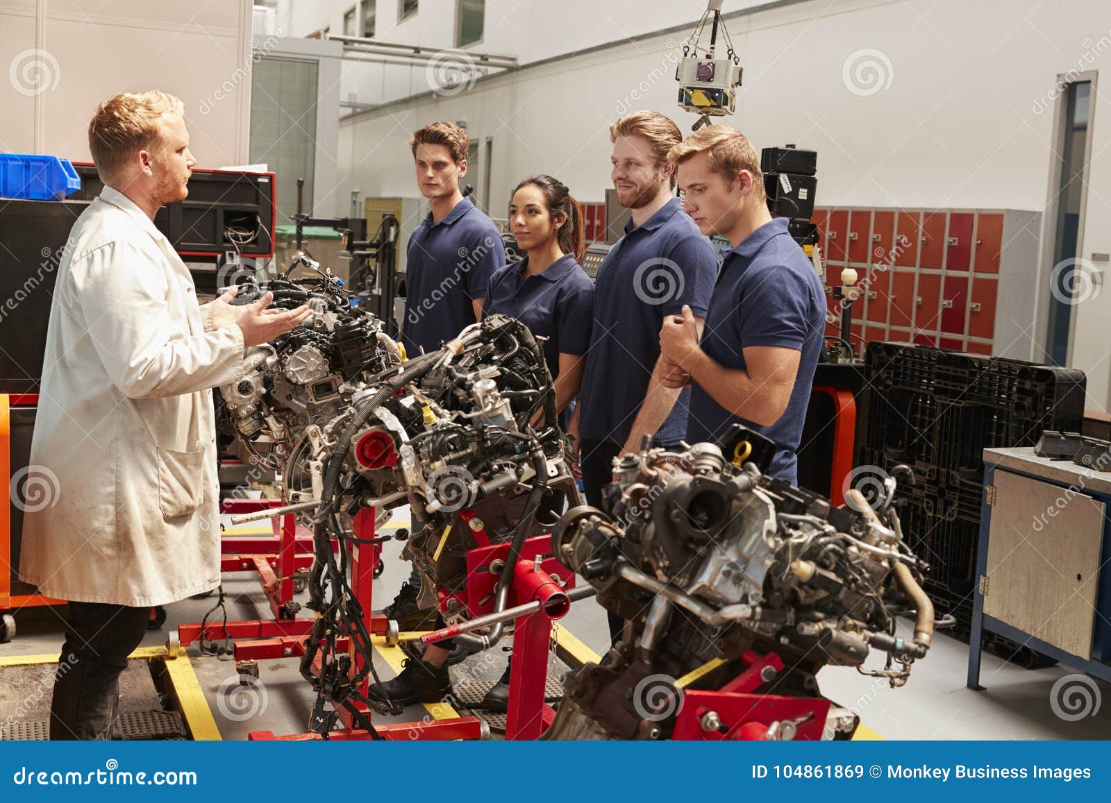 Apprentices Studying Car Engines with a Mechanic Stock Image - Image of ...