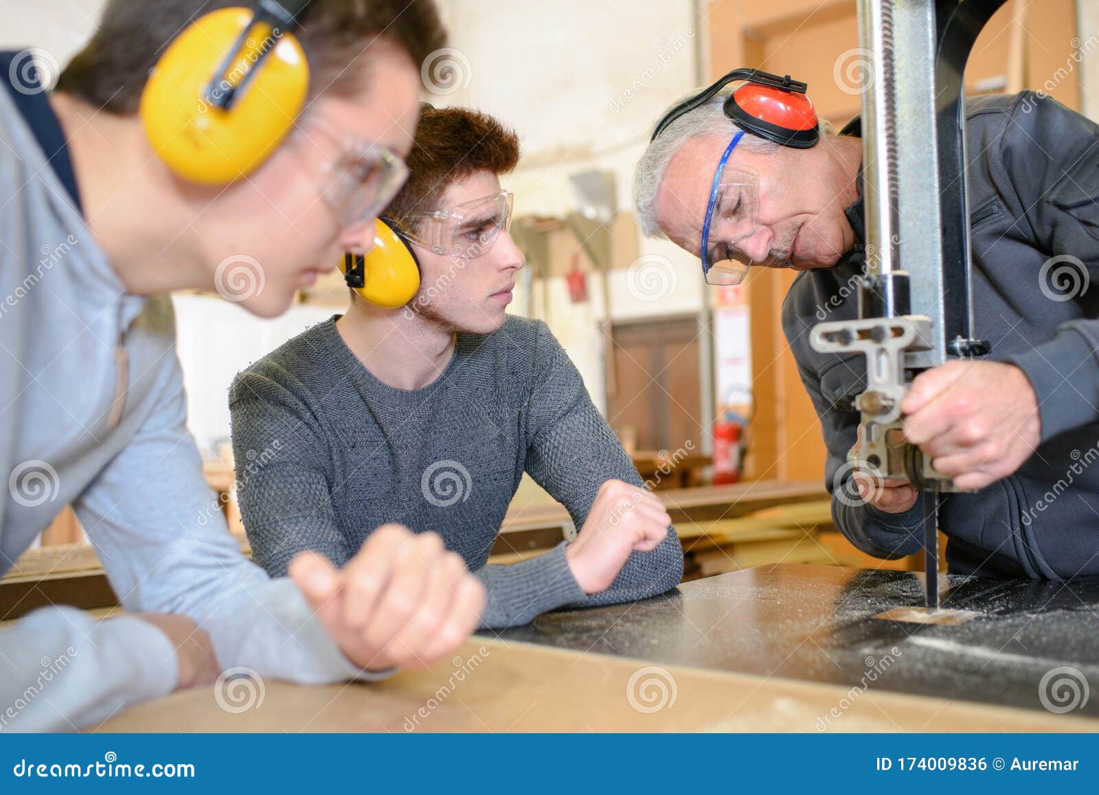 Apprentices Watching Teacher Set Up Bench Saw Stock Photo - Image of ...