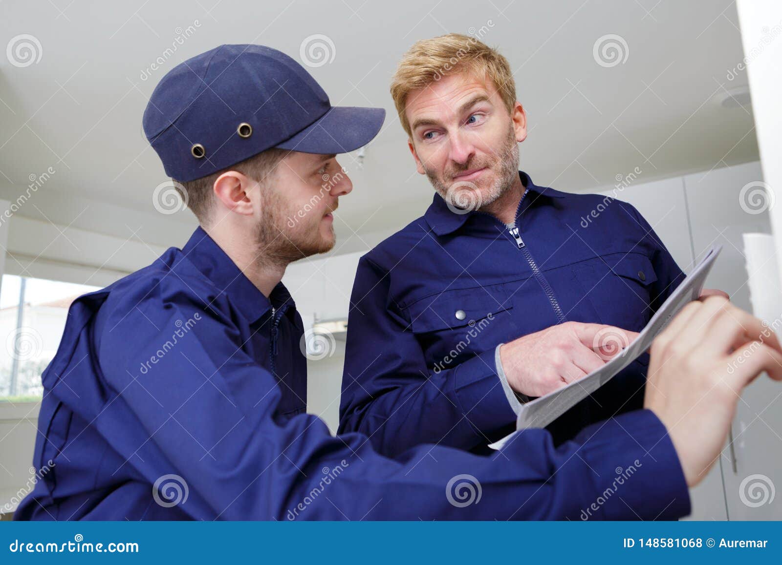 Apprentise Tradesman Talking To Supervisor Stock Photo - Image of ...