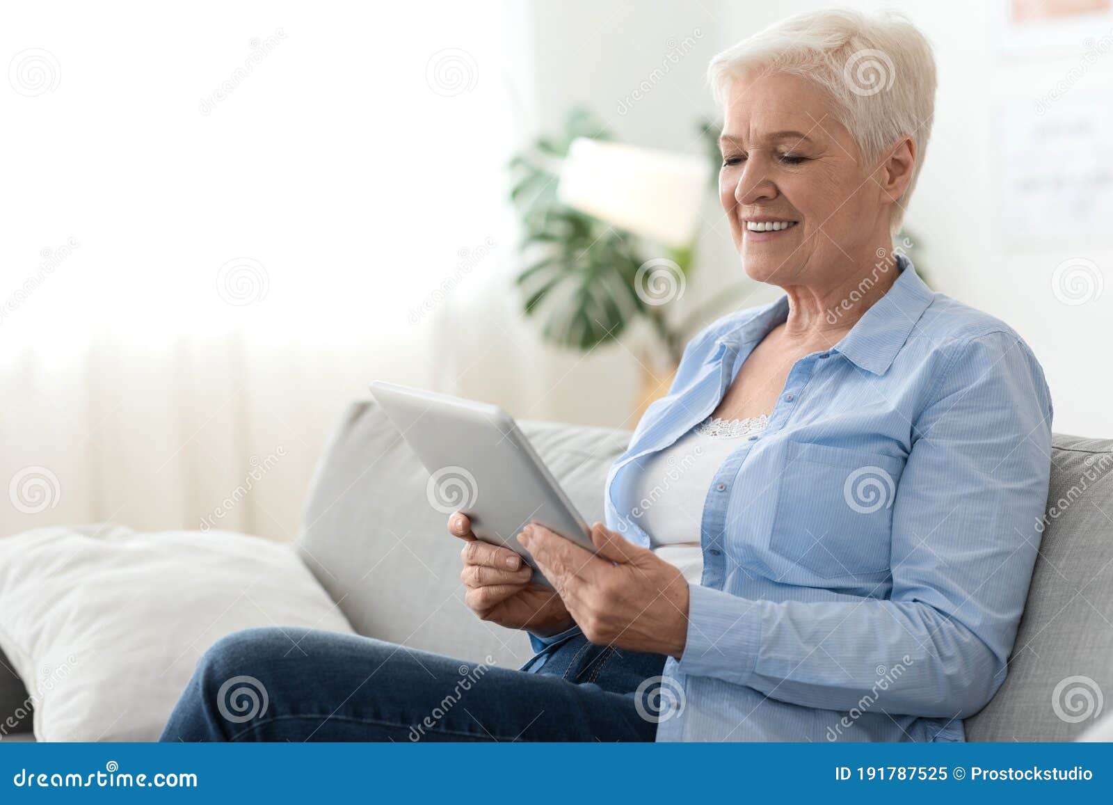 Apps for Seniors. Elderly Lady Using Digital Tablet while Resting at ...