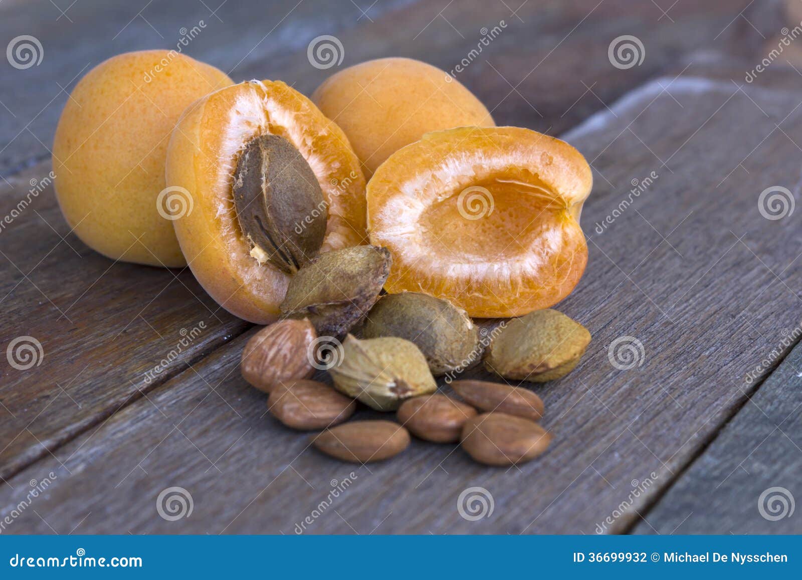 Apricot Fruit Cut Open with Pips and Kernels in the Foreground. Stock ...