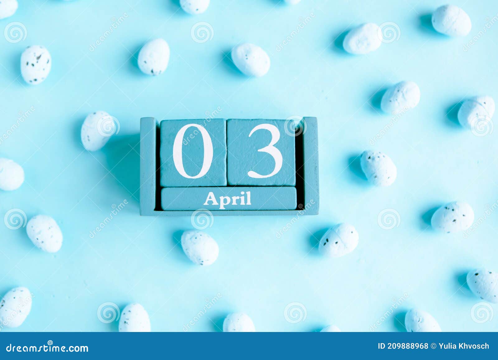 April 3. Blue Cube Calendar with Month and Date on Blue Background ...