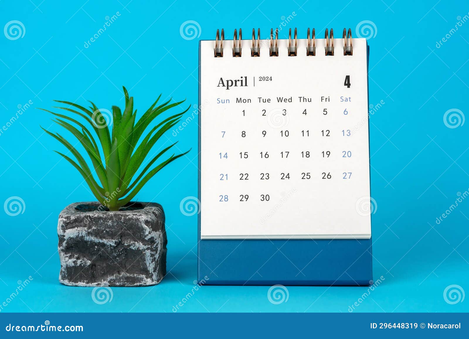 April 2024 Desk Calendar on Blue Background Stock Image - Image of copy ...