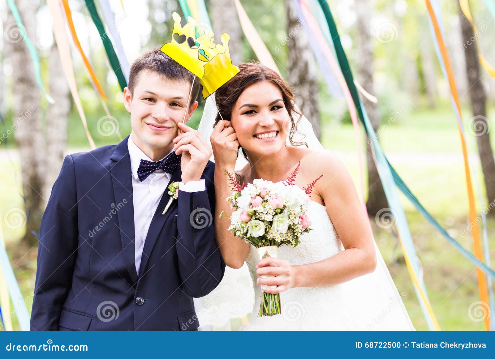 April Fools Day. Wedding Couple Posing with Crown, Mask. Stock Photo ...