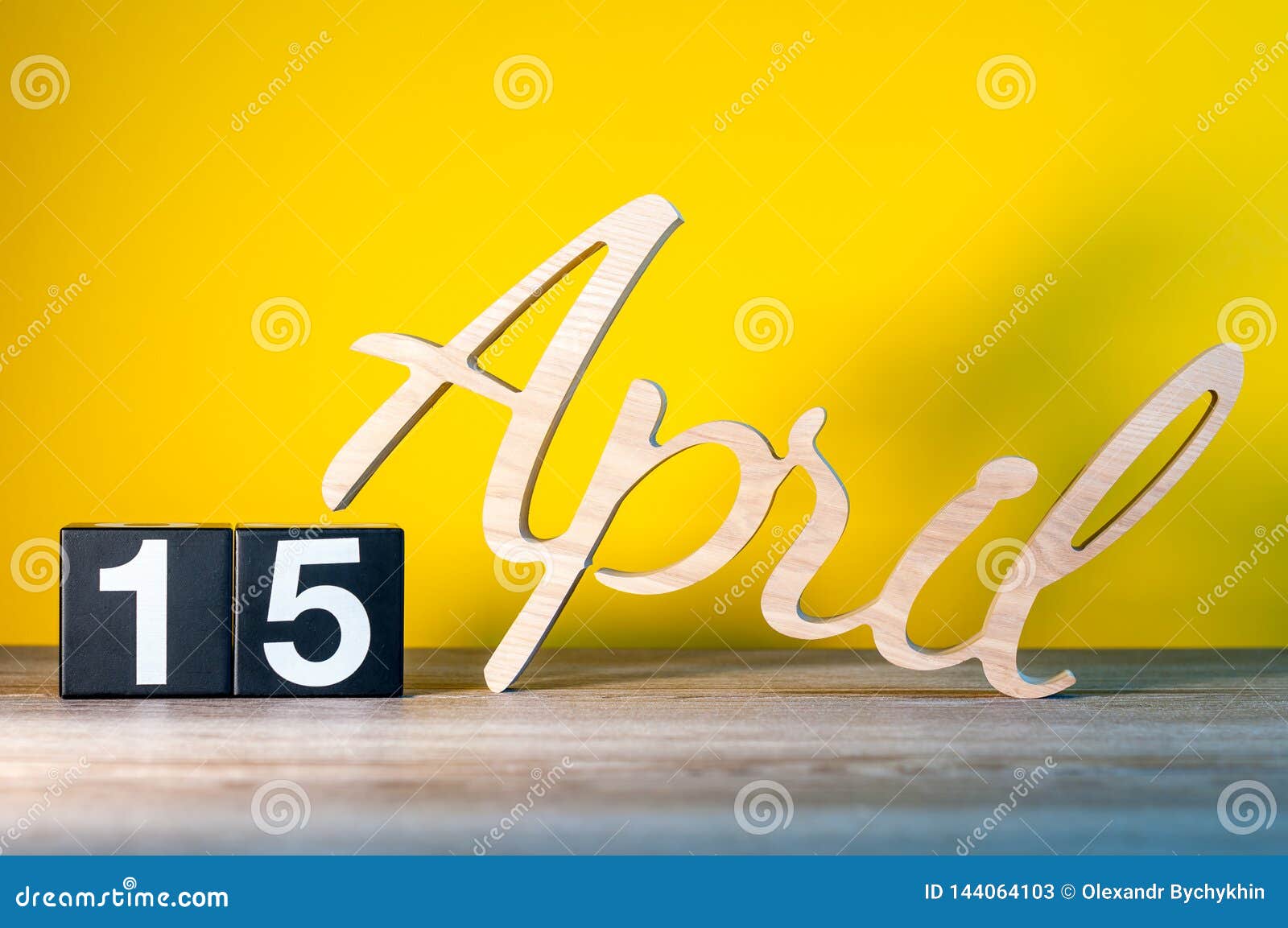 April 15th. Day 15 of Month, Calendar on Wooden Table and Green ...