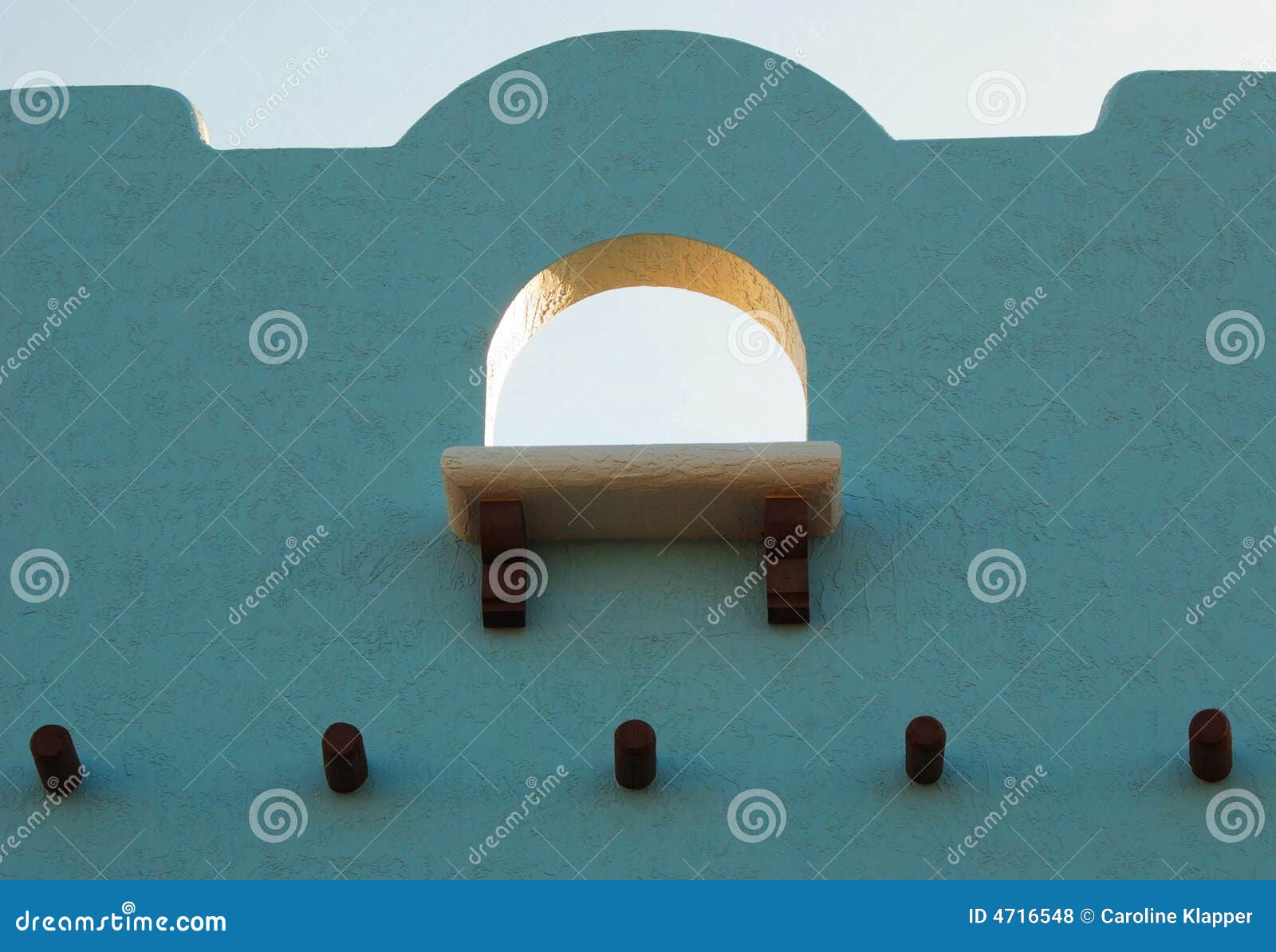 Adobe Style Building With Flat Roof And Balcony With Rain Gutter Posts ...