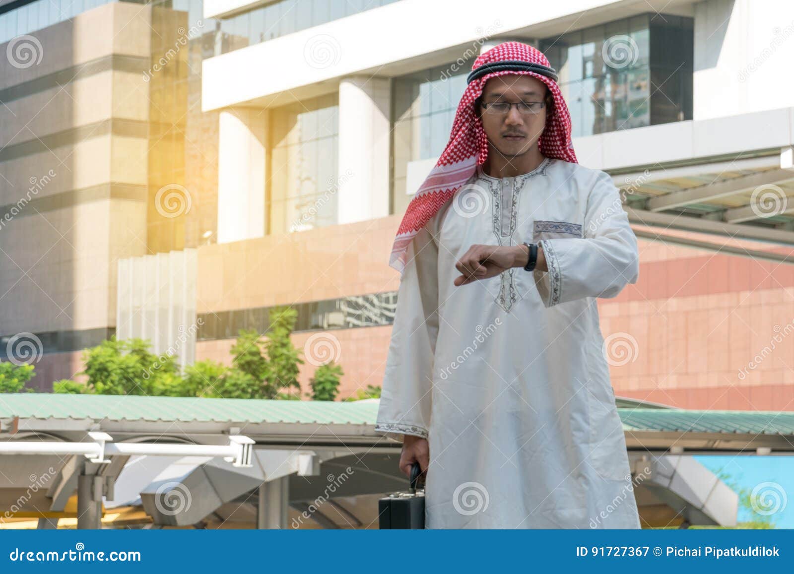 Arab Business Man Checking the Time on Her Watch. Stock Image - Image ...