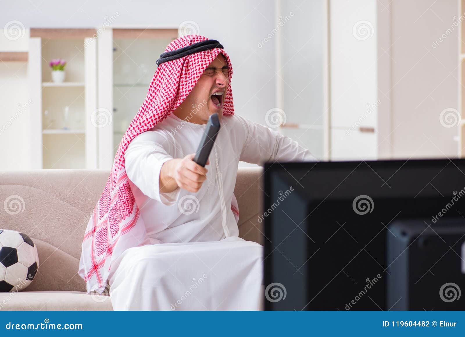 The Arab Businessman Watching Tv at Home Stock Photo - Image of excited ...