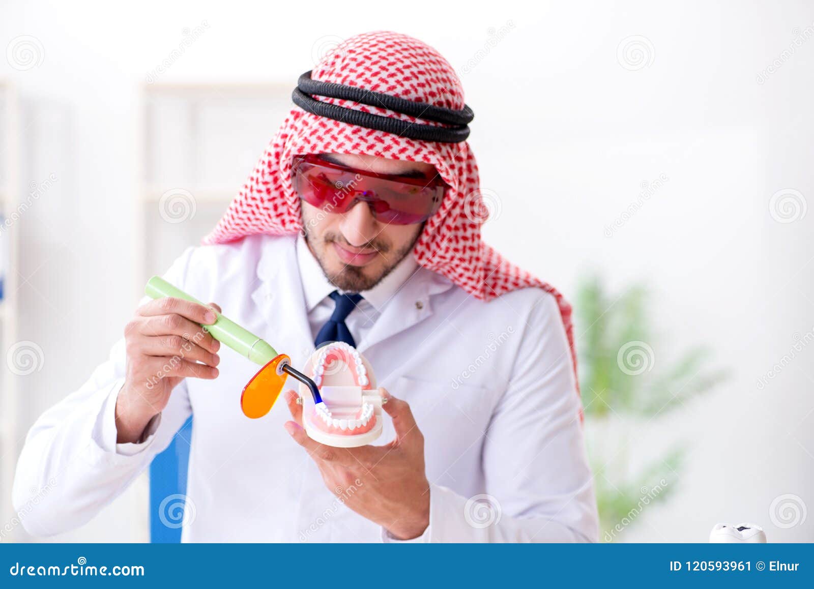 The Arab Dentist Working on New Teeth Implant Stock Image - Image of ...