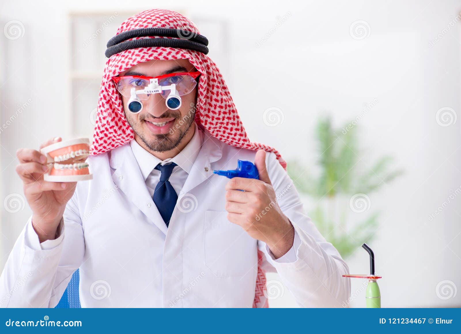 The Arab Dentist Working on New Teeth Implant Stock Image - Image of ...