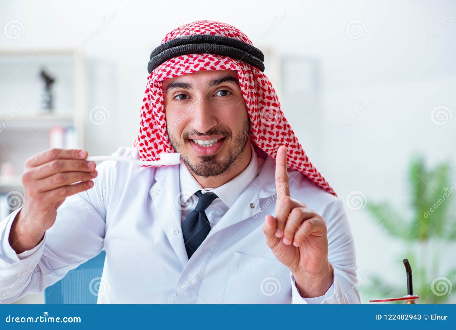 The Arab Dentist Working on New Teeth Implant Stock Image - Image of ...