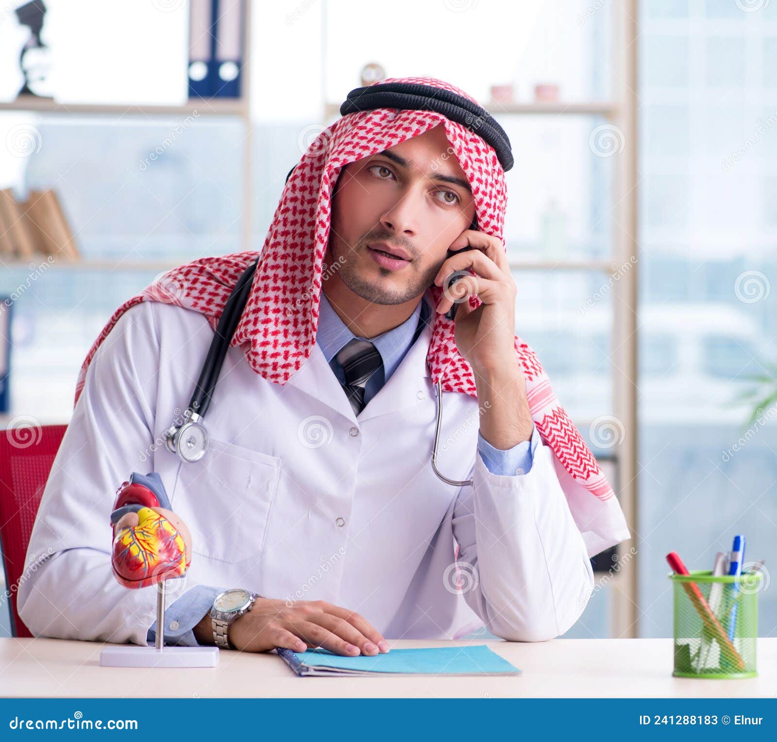 The Arab Doctor Cardiologist Working in the Clinic Stock Image - Image ...