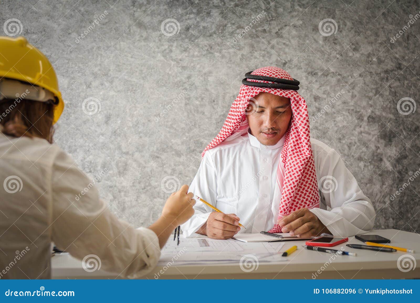 Arab Engineer Working with Workmate in Contractor Office Stock Photo ...