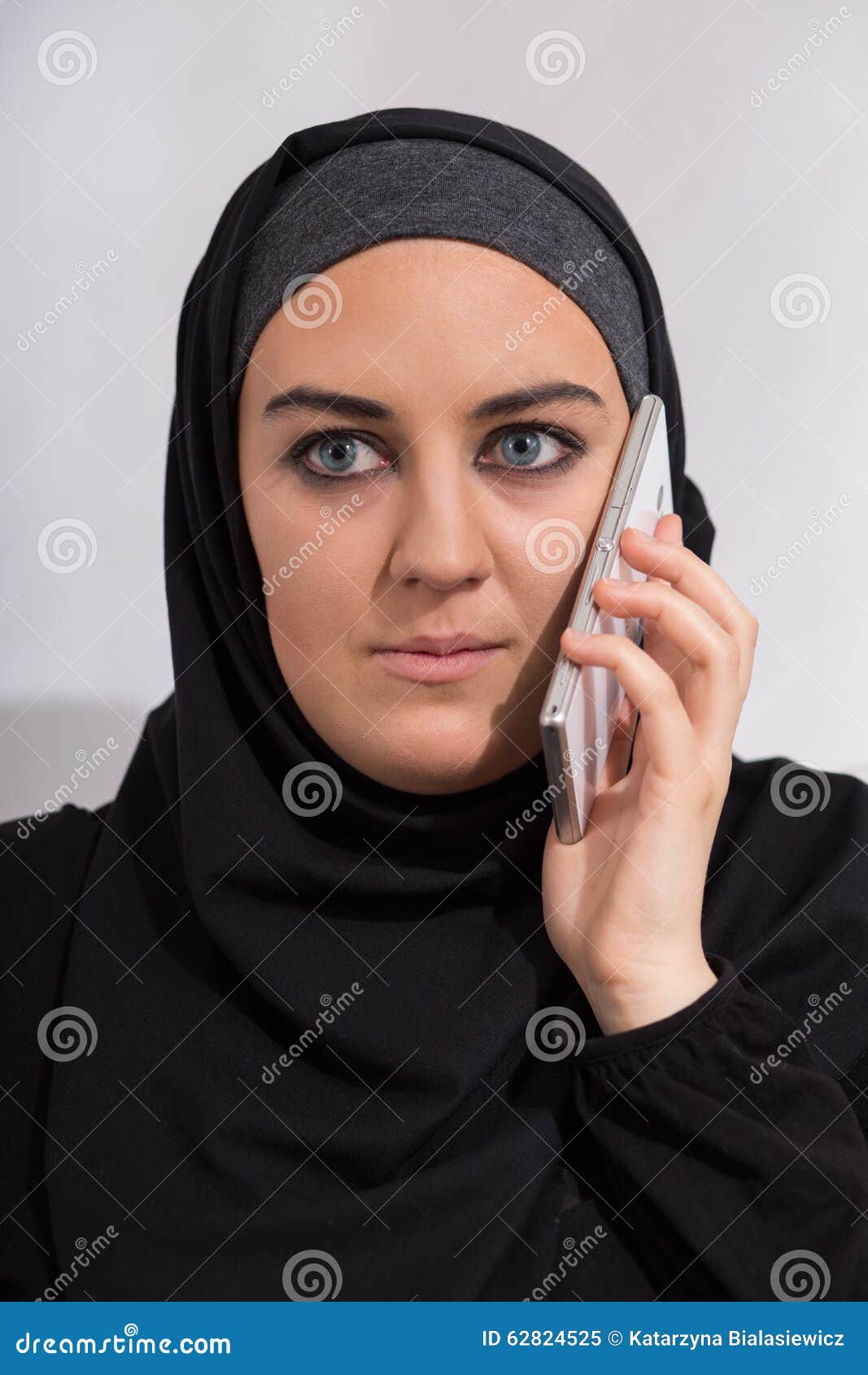 Arab girl with a phone stock image. Image of headscarf - 62824525