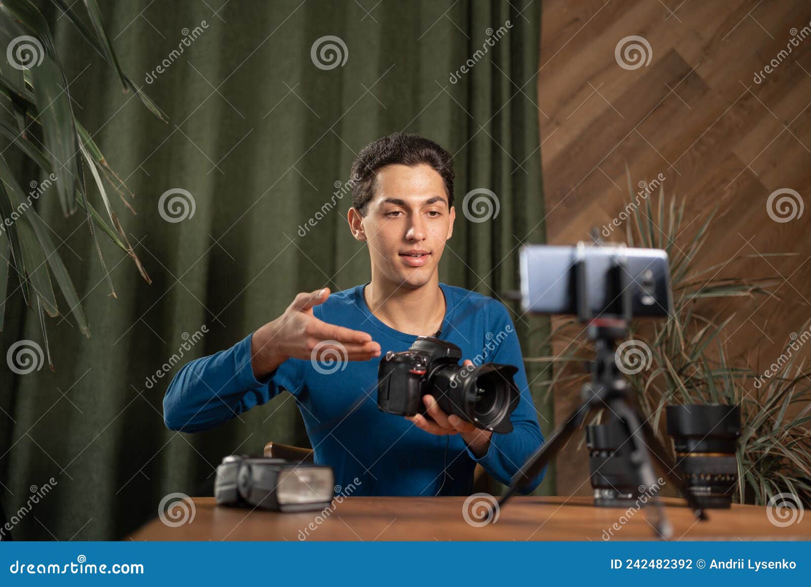 Arab Guy Photographer Makes an Overview of the Camera Settings and ...