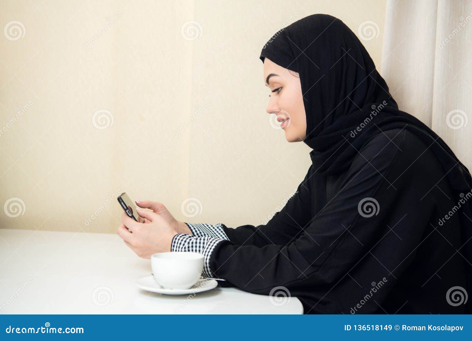 Arab Happy Casual Woman Using a Smart Phone at Home Stock Image - Image ...