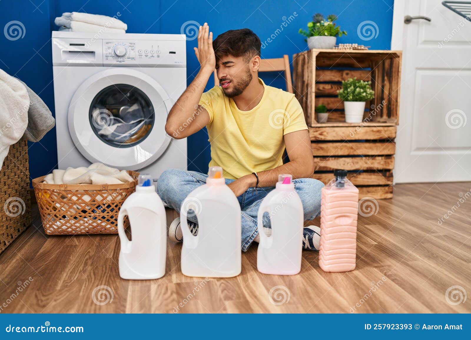Arab Man with Beard Doing Laundry Sitting on the Floor with Detergent ...